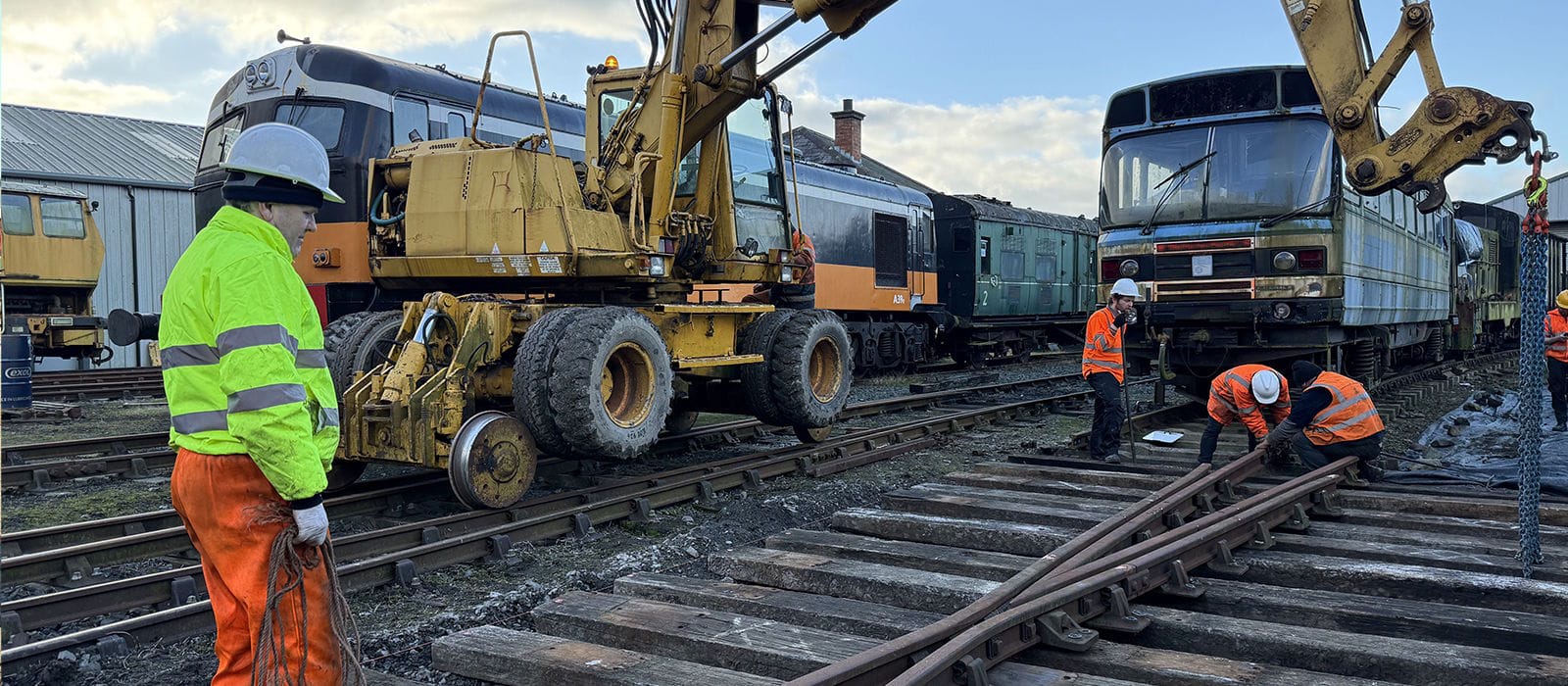 Volunteers lay first new track section in 10 years - Downpatrick and ...